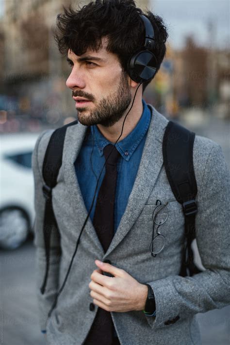 Handsome Businessman Listening Music With Headphones By Stocksy