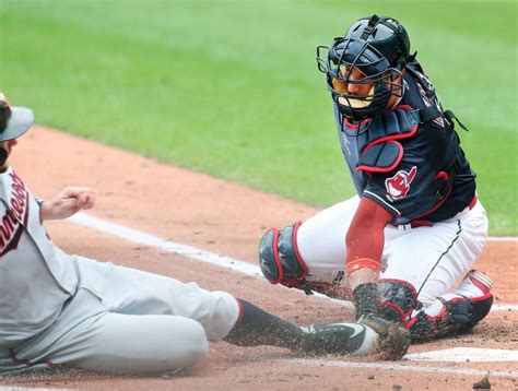 Cleveland Indians Yan Gomes Grabbing The Throw From Edwin Encarnacion