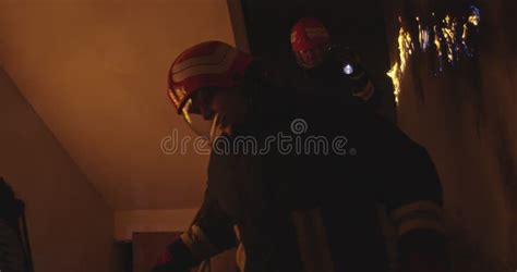 Brave Fireman Descends Stairs Of A Burning Building And Holds Saved