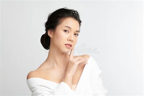 Beautiful Young Asian Woman With Clean Fresh Skin On White Background
