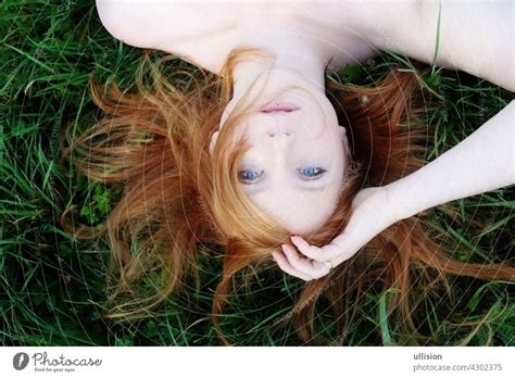 Portrait Of A Beautiful Young Sexy Red Haired Woman Lying In The