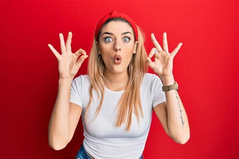 Young Caucasian Woman Wearing Casual White T Shirt Looking Surprised
