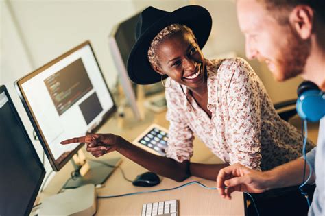 a woman who is a web developer without a degree with her
