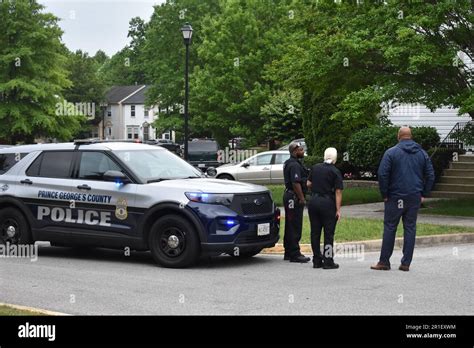 Prince Georges County Police Department Officers Converse With Each