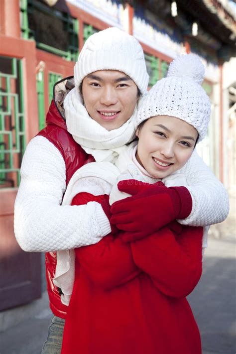 Happy Couple Holding Hands And Going For A Walk In The Park In
