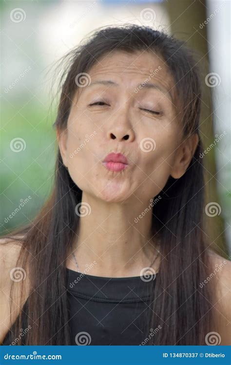 Senior Man Kissing His Wife Hand While Sitting At Home Royalty Free