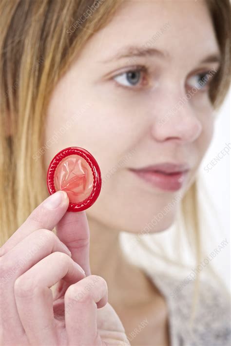 Woman Holding A Condom Stock Image F011 7293 Science Photo Library