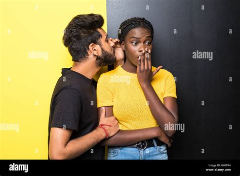 Young Happy Mixed Race Couple Indian Man Whispering Secrets African
