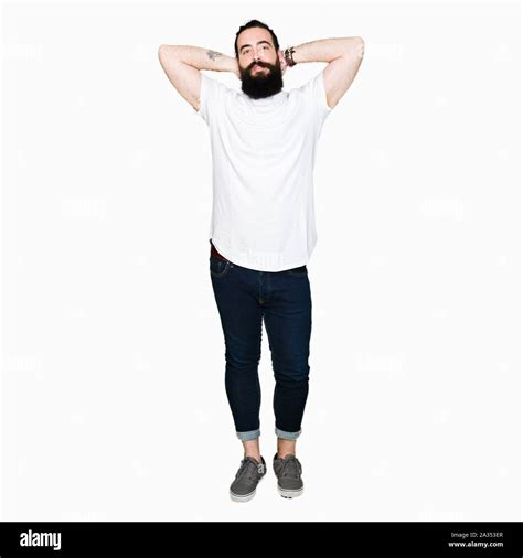 Young Hipster Man With Long Hair And Beard Wearing Casual White T Shirt