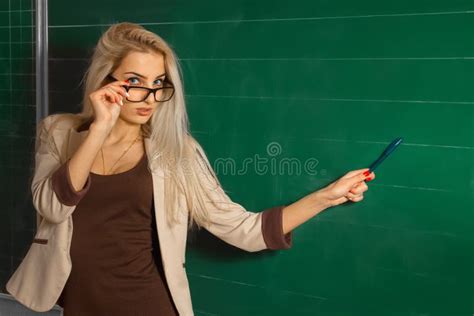 Blonde Teacher Walking In City And Standing In Road Background Stock