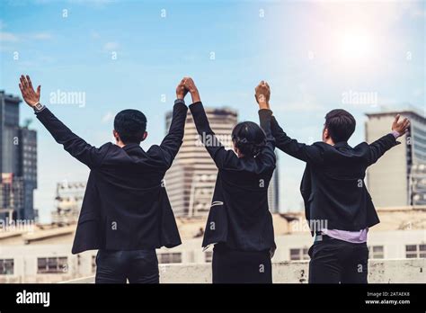 Happy Businessmen And Businesswoman Celebrate Success In Project Task
