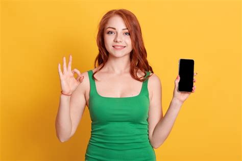 Premium Photo Young Caucasian Woman Wearing In Green Shirt Showing Ok