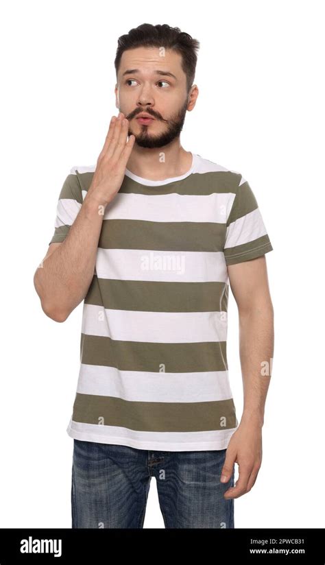 Embarrassed Man Covering Mouth With Hand On White Background Stock
