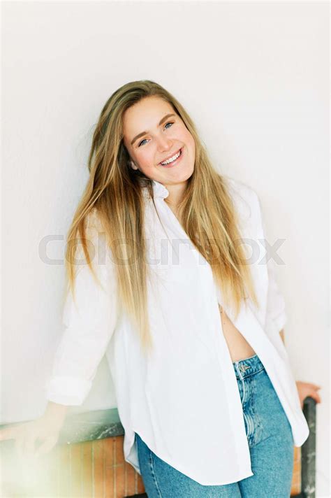 Indoor Portrait Of Happy Young Female Model 20 Year Old Girl Wearing