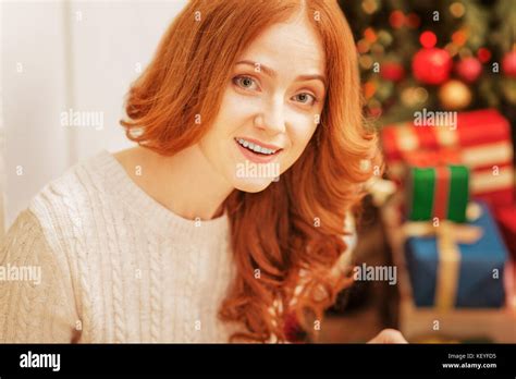 Surprised Mature Woman Looking Into Camera On Christmas Morning Stock