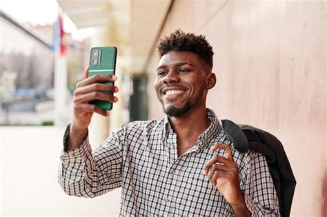 Premium Photo Man With Jacket Over His Shoulder Taking A Selfie