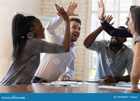 Multiracial Euphoric Business Team People Give High Five In Office