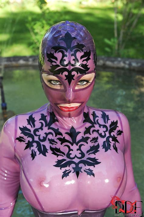 latex addicted babe latex lucy poses at the backyard in crazy uniform
