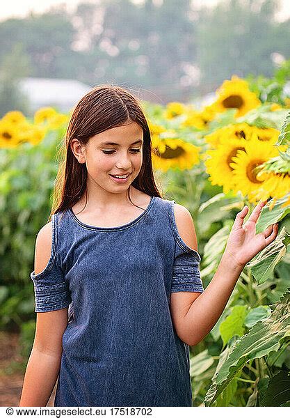 Happy Tween Girl In A Sunflower Field Happy Tween Girl In A Sunflower