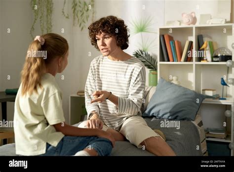 Mother Having Serious Conversation With Her Daughter She Talking About