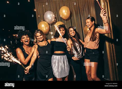 Group Of Women With Fireworks At Party Stylish Girls Enjoying Party At