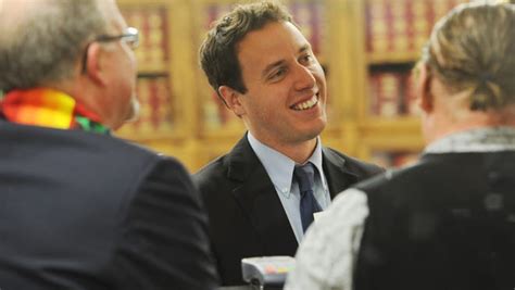 register of deeds drew reisinger smiles while talking with couples