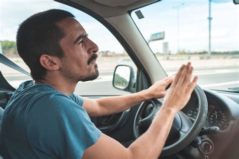 Premium Photo Happy Young Man Driving A Car Dancing And Singing Fun