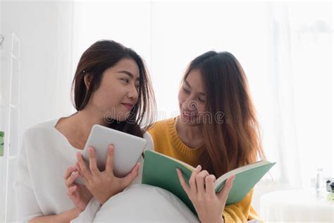 Asia Lesbian Lgbt Couple Lay On Bed And Hug Rainbow Color Pillow Heart