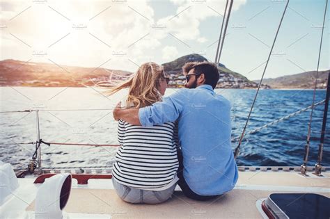 Romantic Young Couple On A Boat Containing Adult Back And Boat High
