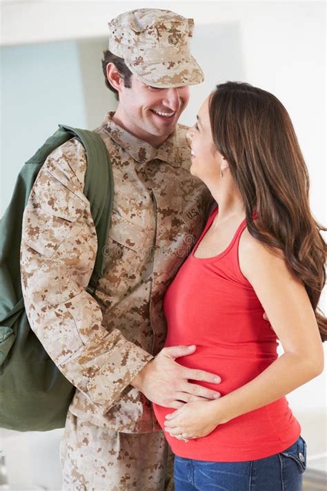 Pregnant Wife Greeting Military Mother Home On Leave Stock Image