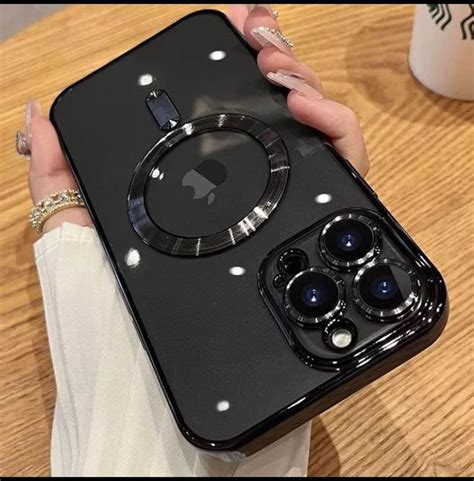 A Womans Hand Holding An Iphone Case That Has Multiple Buttons On The