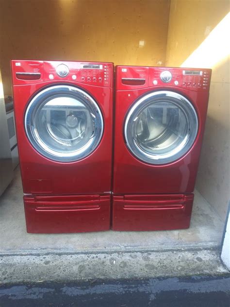 lg red front load washer and dryer on pedestal for sale in portland or