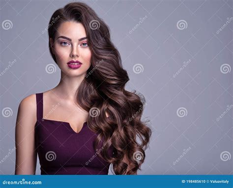 Face Of A Beautiful Woman With Long Brown Curly Hair Fashion Model