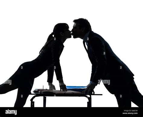 One Caucasian Business Woman Man Couple Lovers Kissing In Silhouette