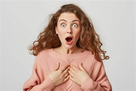 Premium Photo Surprised Woman With Hands On Face