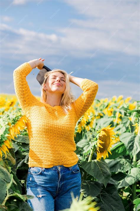 Premium Photo Beautiful Cute Sexy Girl In A Yellow Sweater Jeans And