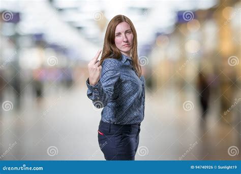 Pretty Young Business Woman Giving Flipping The Bird Over Blur B Stock