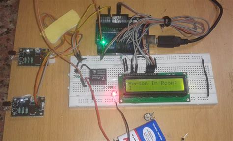 automatic room light controller with bidirectional visitor counter