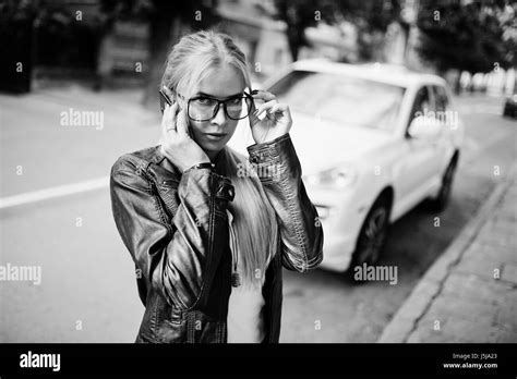 Stylish Blonde Woman Wear At Jeans Glasses And Leather Jacket With