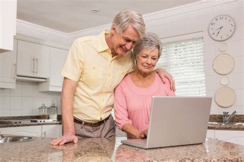 Premium Photo Senior Couple Using The Laptop Together