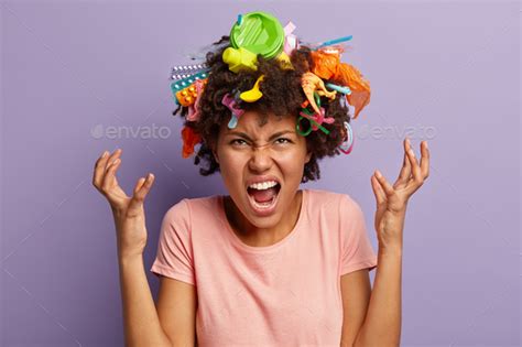 Irritated Dark Skinned Woman Screams Angrily Raises Hands
