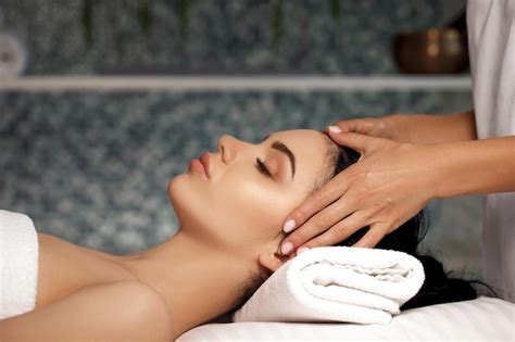 Premium Photo Anti Aging Facial Massage Woman Receiving Massage From