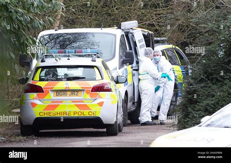 Police Forensics Officers At The Scene In Culcheth Linear Park In