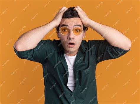 Free Photo Young Man In Green Shirt Wearing Glasses Looking At Front