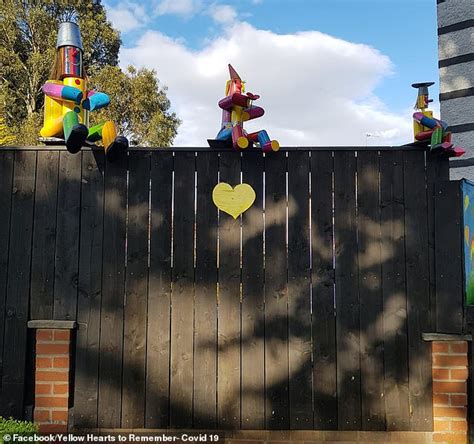 Mourning Families Put Yellow Hearts In Their Windows In A Tribute To