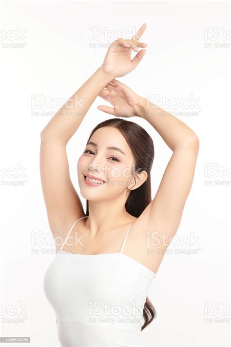 Beautiful Young Asian Woman Lifting Hands Up To Show Off Clean And