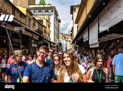 A Young Couple Using A Selfie Stick To Take A Selfi In Florence