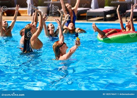 Multiracial Group Of Friends Having Party In Private Villa Swimming