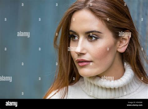 Outdoor Portrait Of Beautiful Girl Or Young Woman With Red Hair Wearing