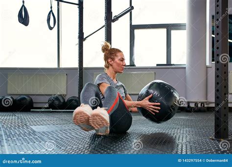 Woman Doing Exercises With Fitball In Fitness Gym Class Engaging Core